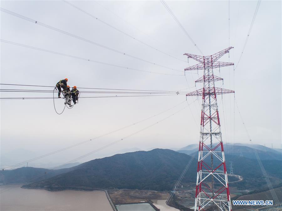 World's highest power supply pylons complete cable construction in Zhoushan, E China's Zhejiang ...