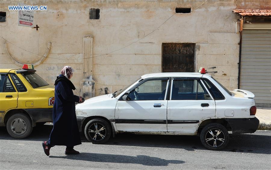Feature: 1st female taxi driver in Syria's Aleppo shows self-reliance ...
