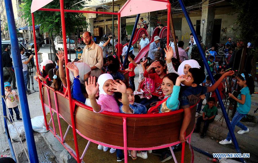 Feature: Syrian children celebrate happy Eid despite destruction left ...
