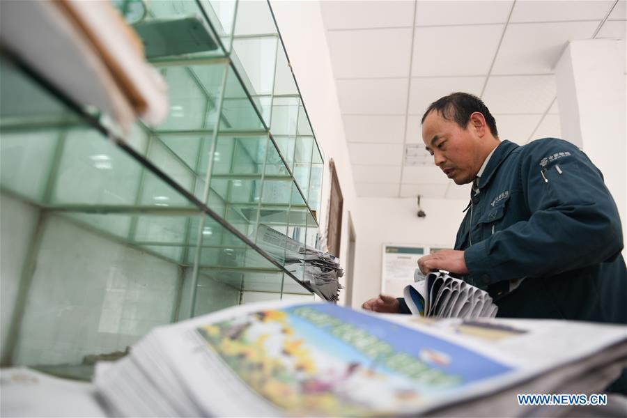 Postman dedicated to serving people in east China town - Xinhua ...