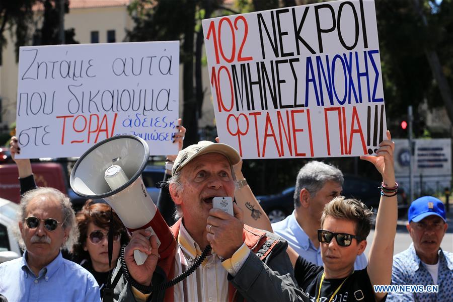 Feature: Residents of fire-stricken resorts near Athens protest delays ...