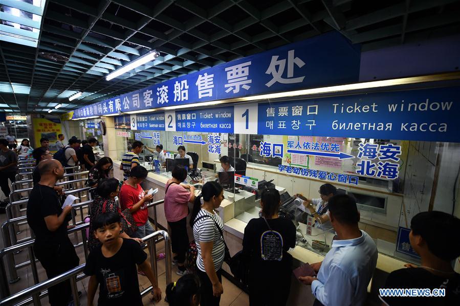 Ferry services across the Qiongzhou Strait partially resumed - Xinhua ...