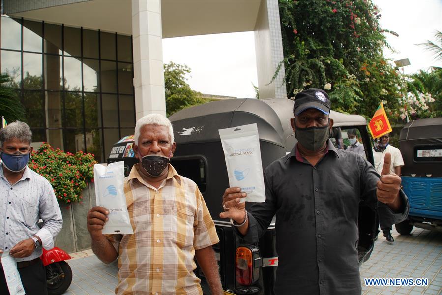 China donates face masks to Sri Lankan three-wheel drivers - BELT AND ...