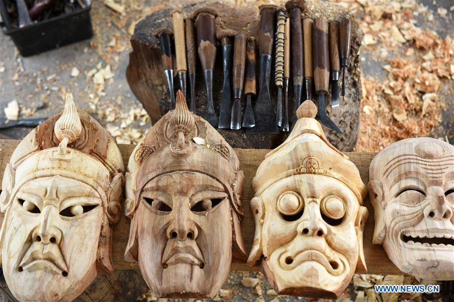 Pic story of inheritor of Nuo mask carving techniques in China's ...