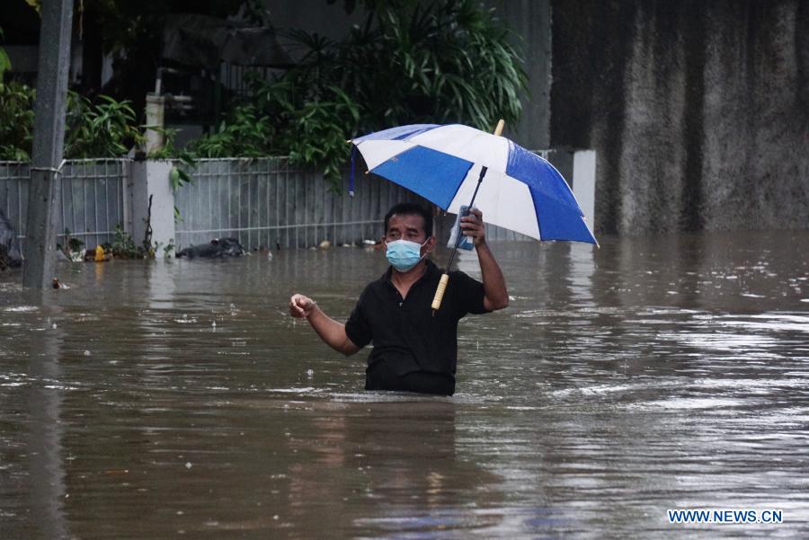 People Walking In The Rain